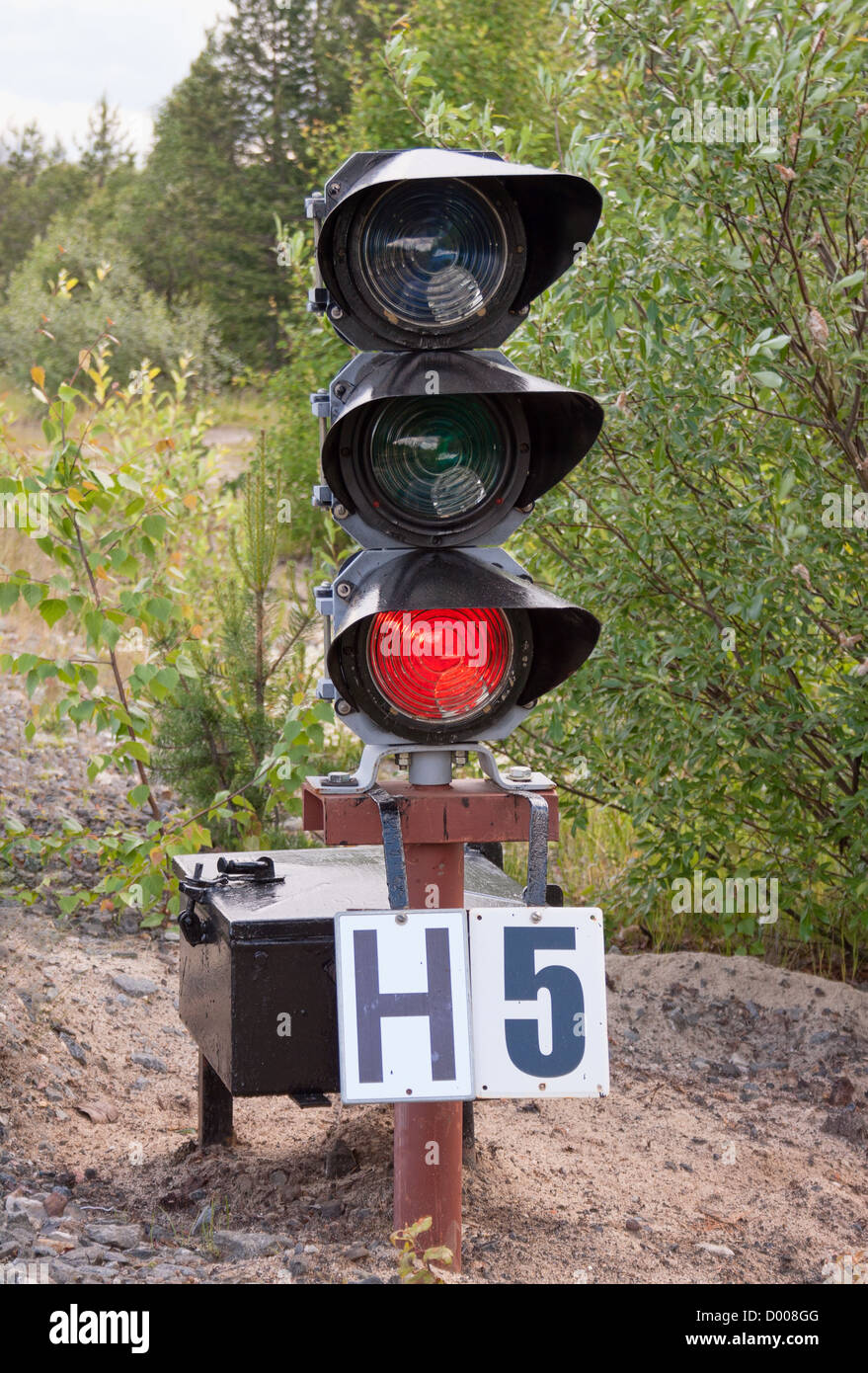 Traffic light shows red signal on railway. Red light Stock Photo - Alamy