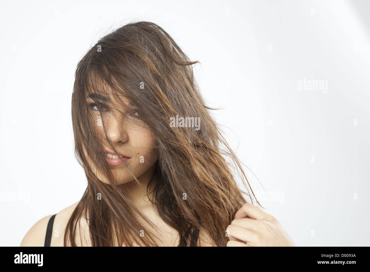 real beautiful young girl playing with her hair Stock Photo - Alamy