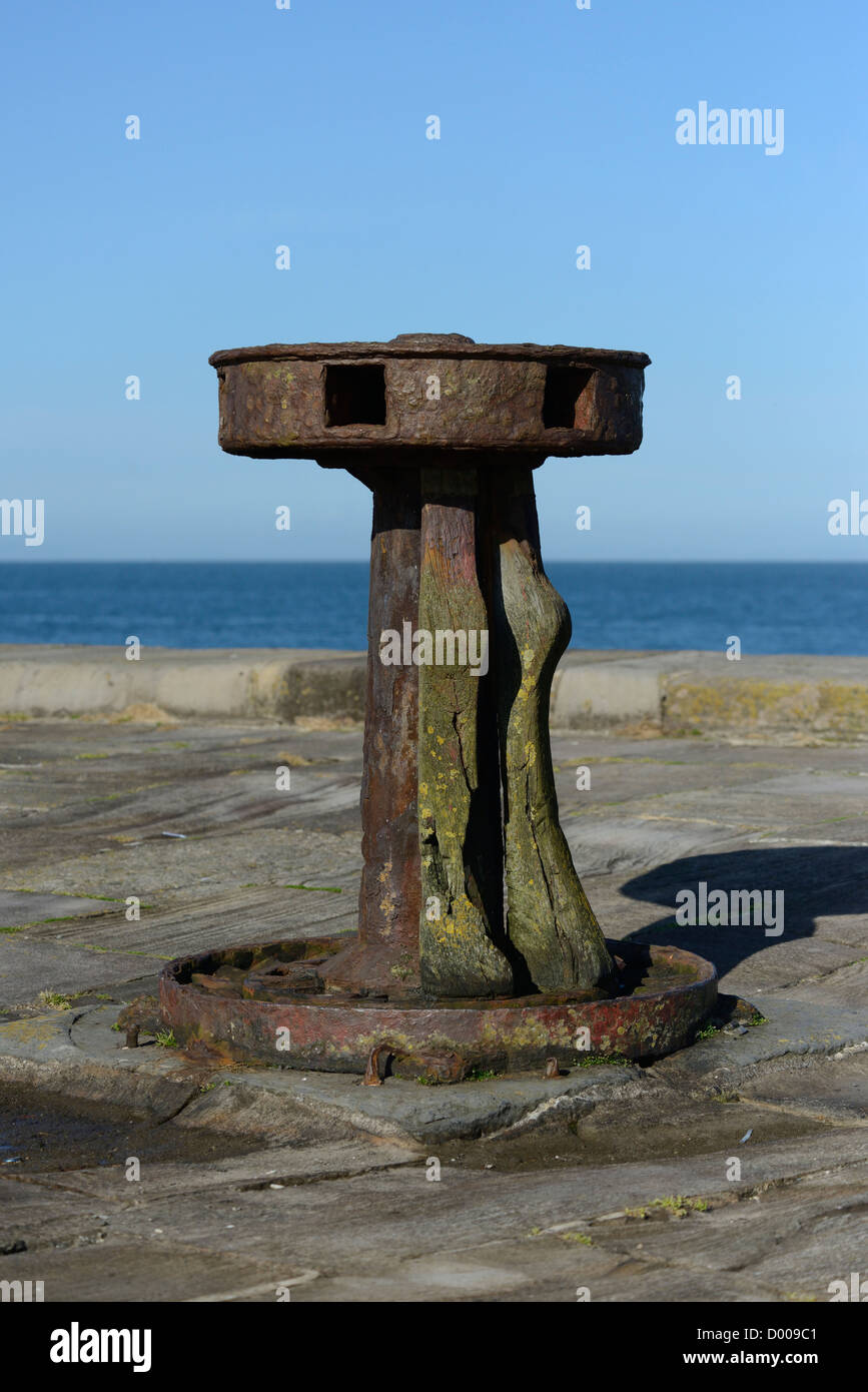 Derelict, rusty, iron and wooden capstan. Fish Harbour, Whitehaven ...