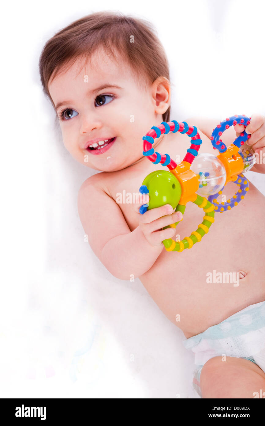 Baby playing with toys in a white isolated background Stock Photo - Alamy
