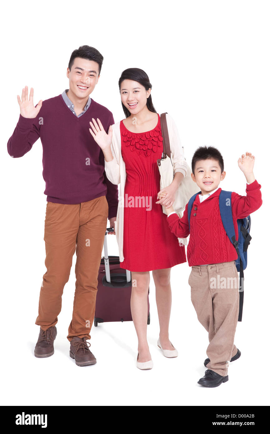 Joyful family going for a vacation Stock Photo - Alamy