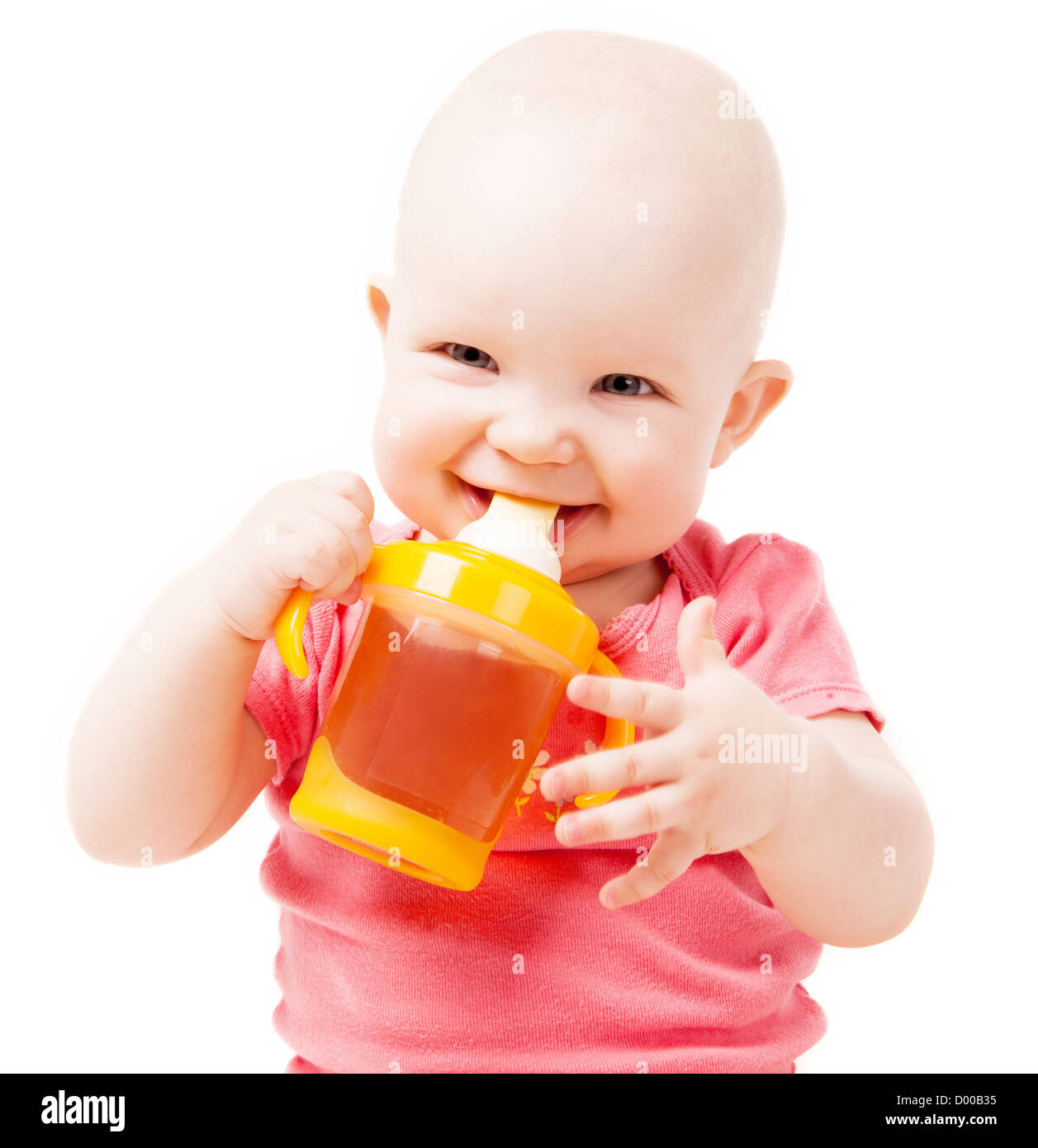 baby drinking juice isolated against white background Stock Photo - Alamy