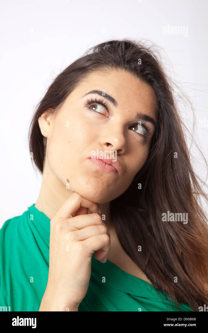 real beautiful young girl thinking expression on wihte Stock Photo - Alamy