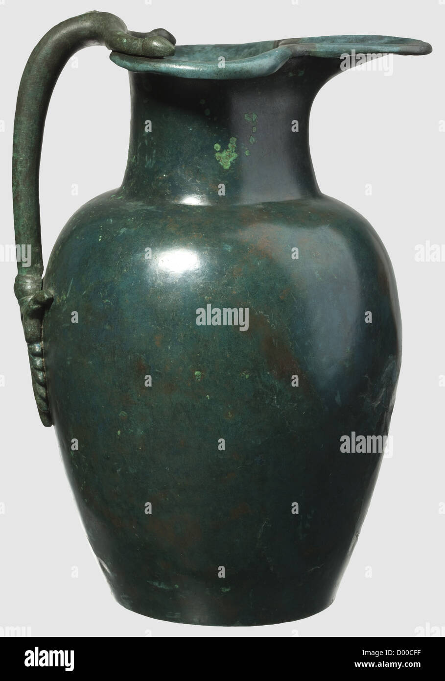 An Etruscan beak-spouted jug, 5th century BC. Bronze with fine, green ...