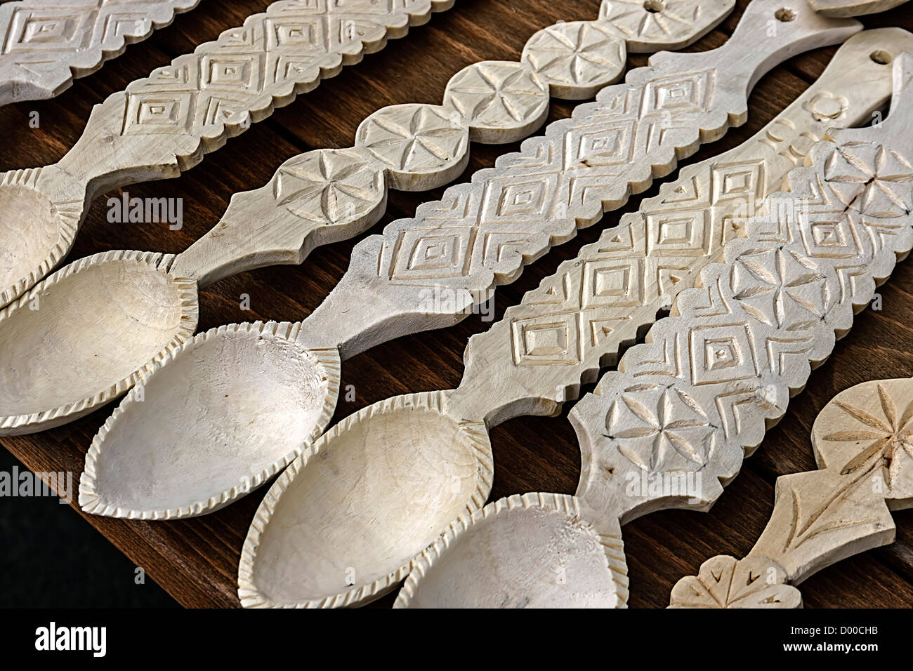 Wooden spoons carved with traditional motifs Romanian Stock Photo - Alamy