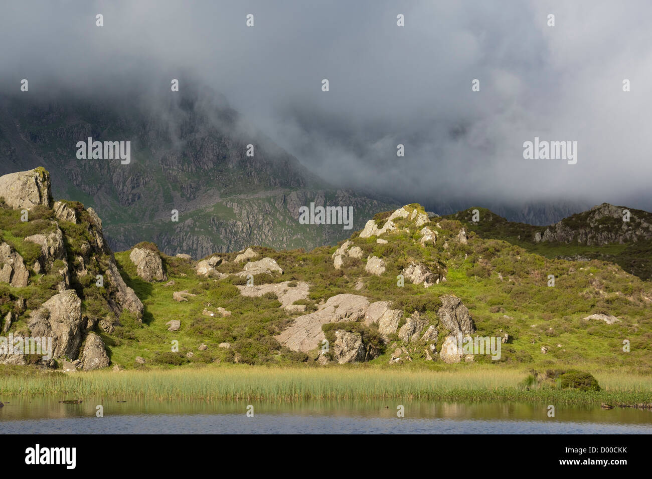 Clouds closing in around the summits that surround Innominate Tarn in ...
