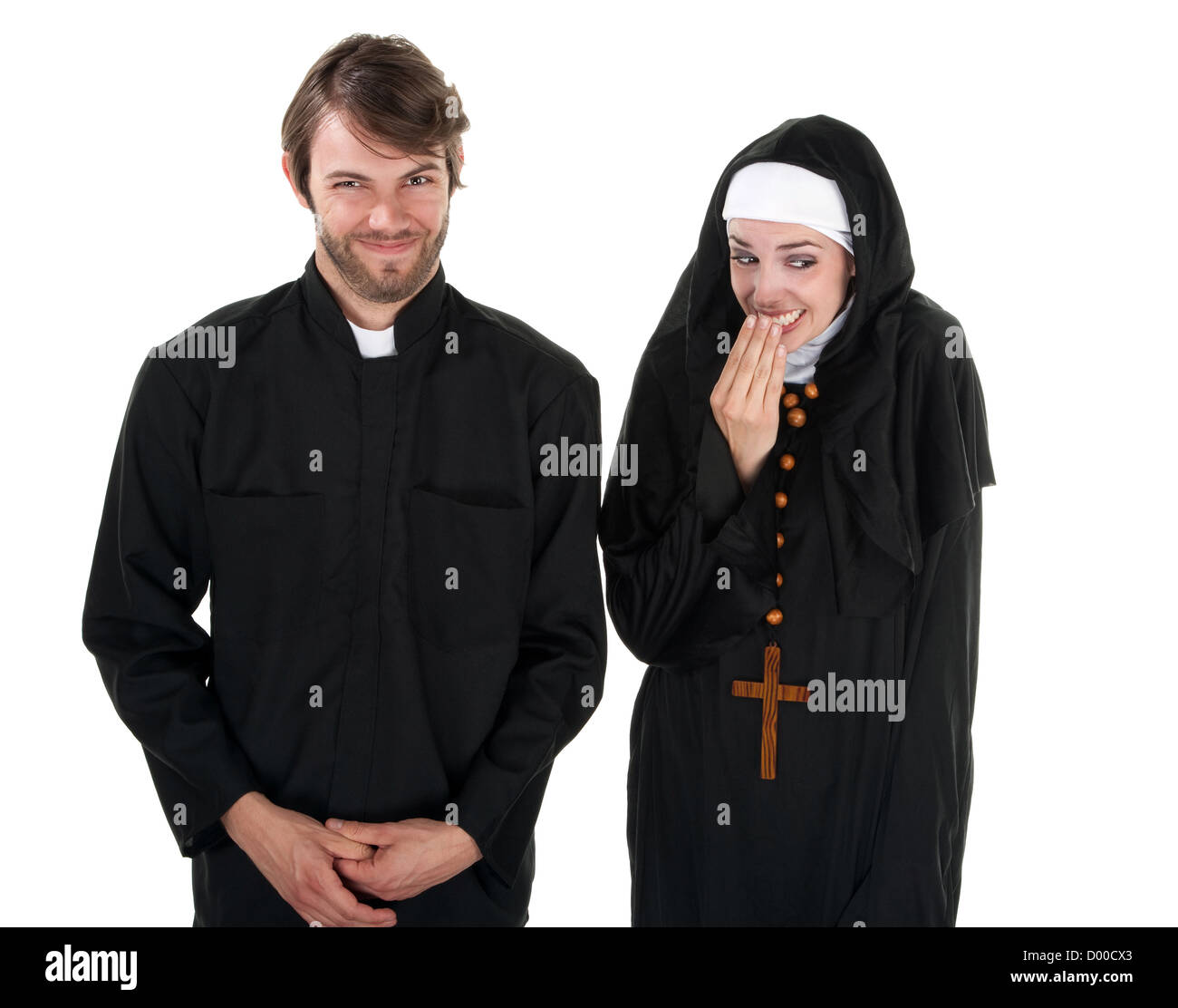 A young Catholic priest and nun on white background giggling Stock ...