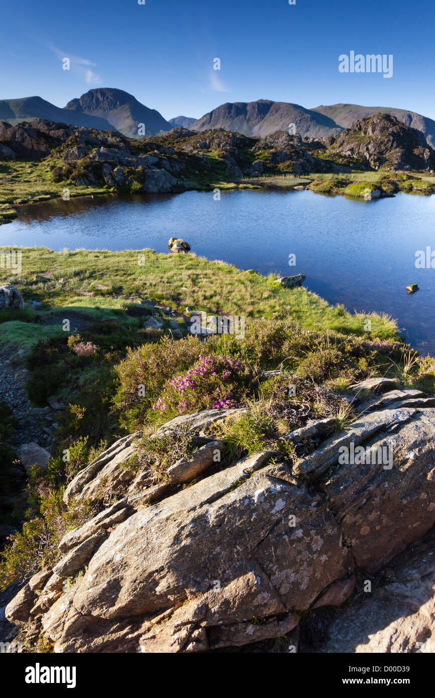 Sun rising over Innominate Tarn with Kirk Fell & Great Gable in the ...