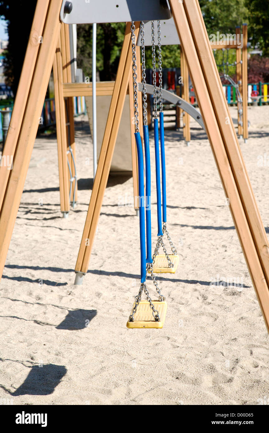 two swings at a public park in madrid city Stock Photo - Alamy