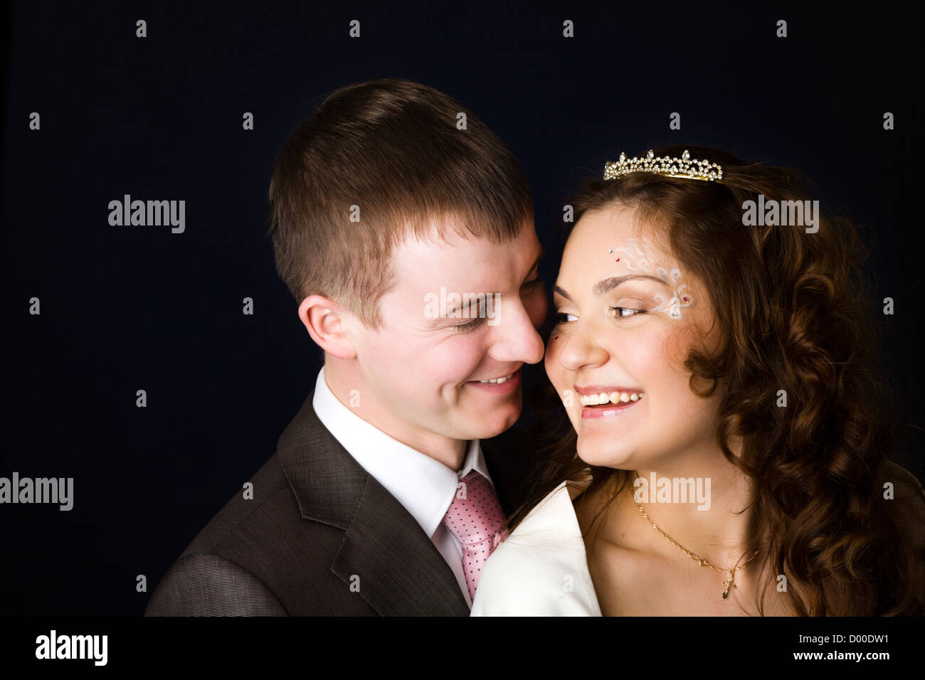 Portrait of Happy New Married couple over dark background Stock Photo ...