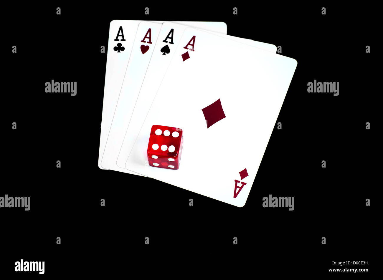 the four aces and a red dice on black background Stock Photo - Alamy