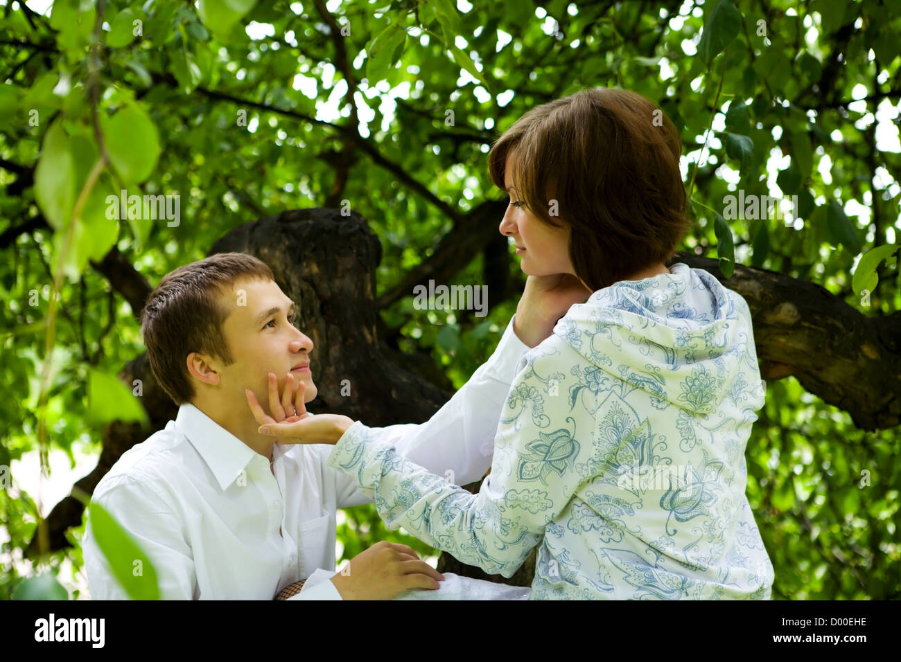Happy young couple spending time together outdoors Stock Photo - Alamy