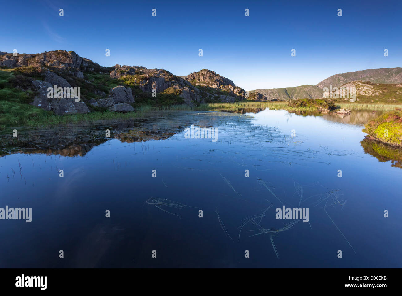 Sun rising over Innominate Tarn in the Lake district, England, UK Stock ...