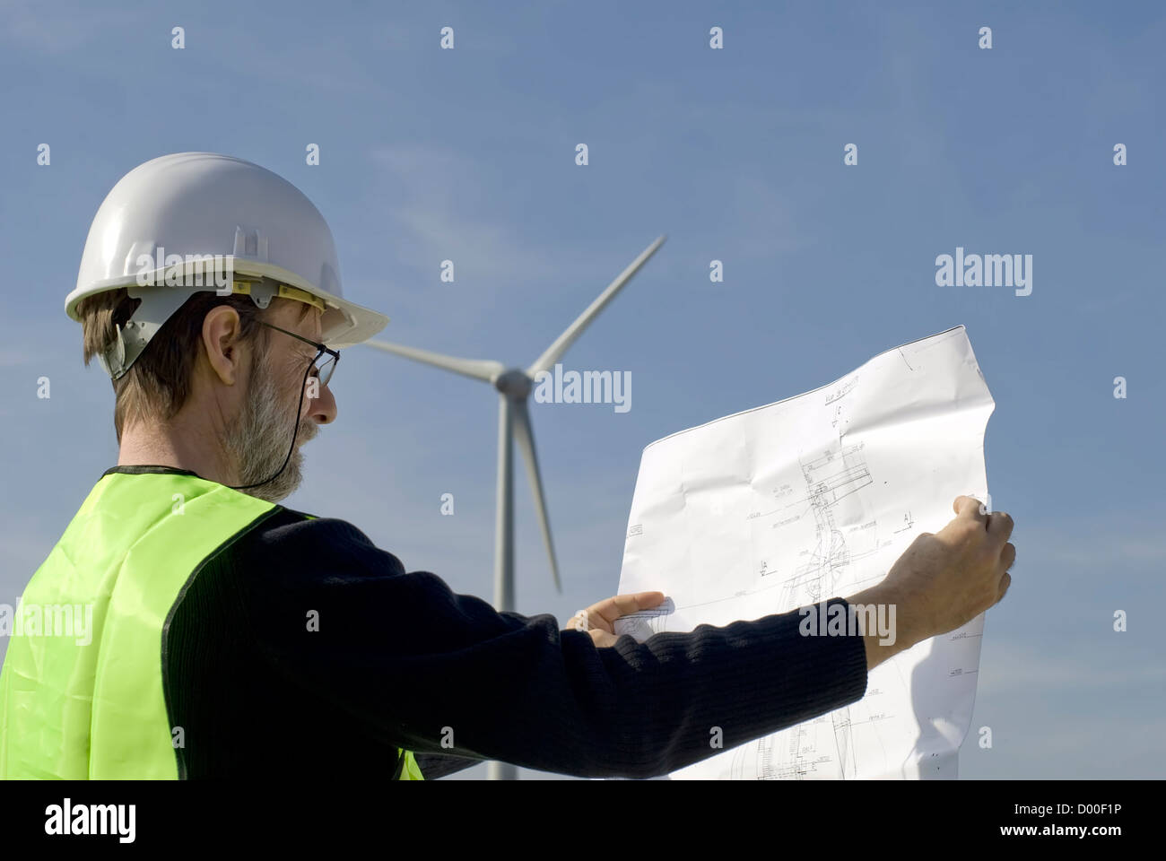 technician on site reading a map Stock Photo - Alamy