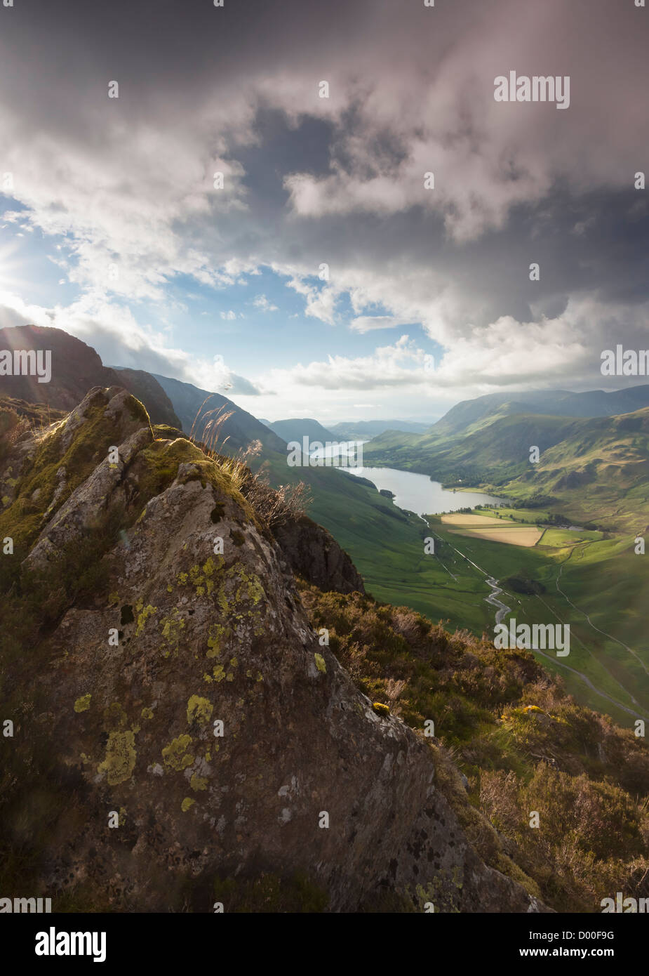 A cloudy sunset over Lake Buttermere from the summit of Haystacks in ...