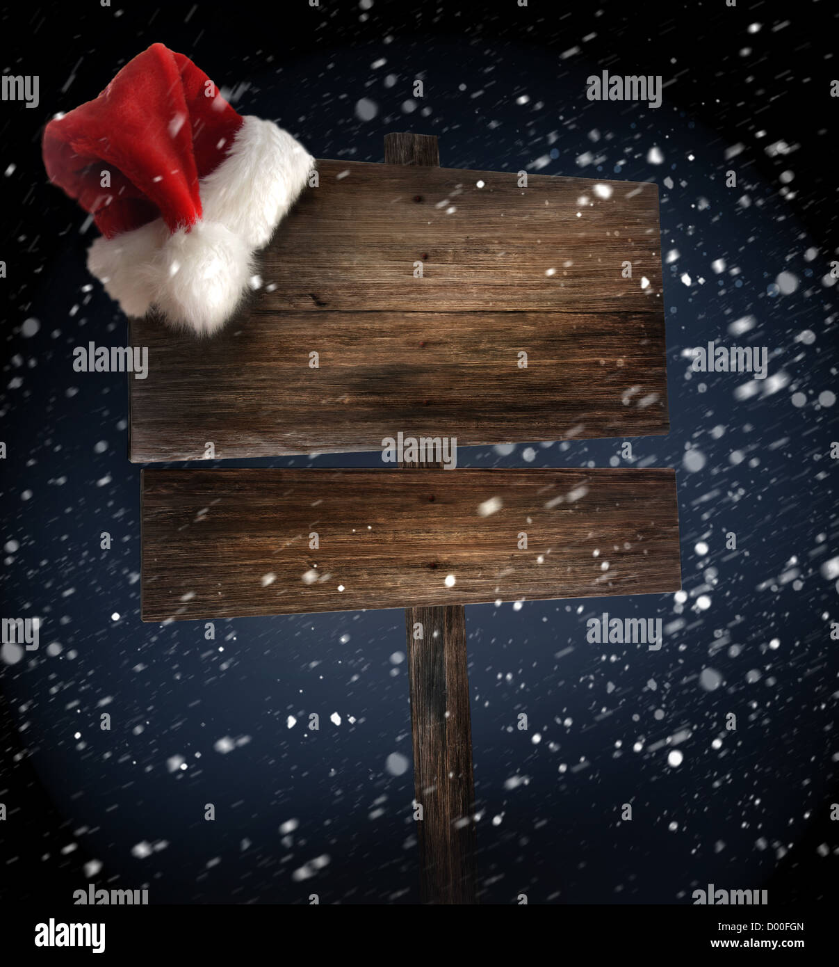 Wooden sign with santa hat on snowy background Stock Photo - Alamy