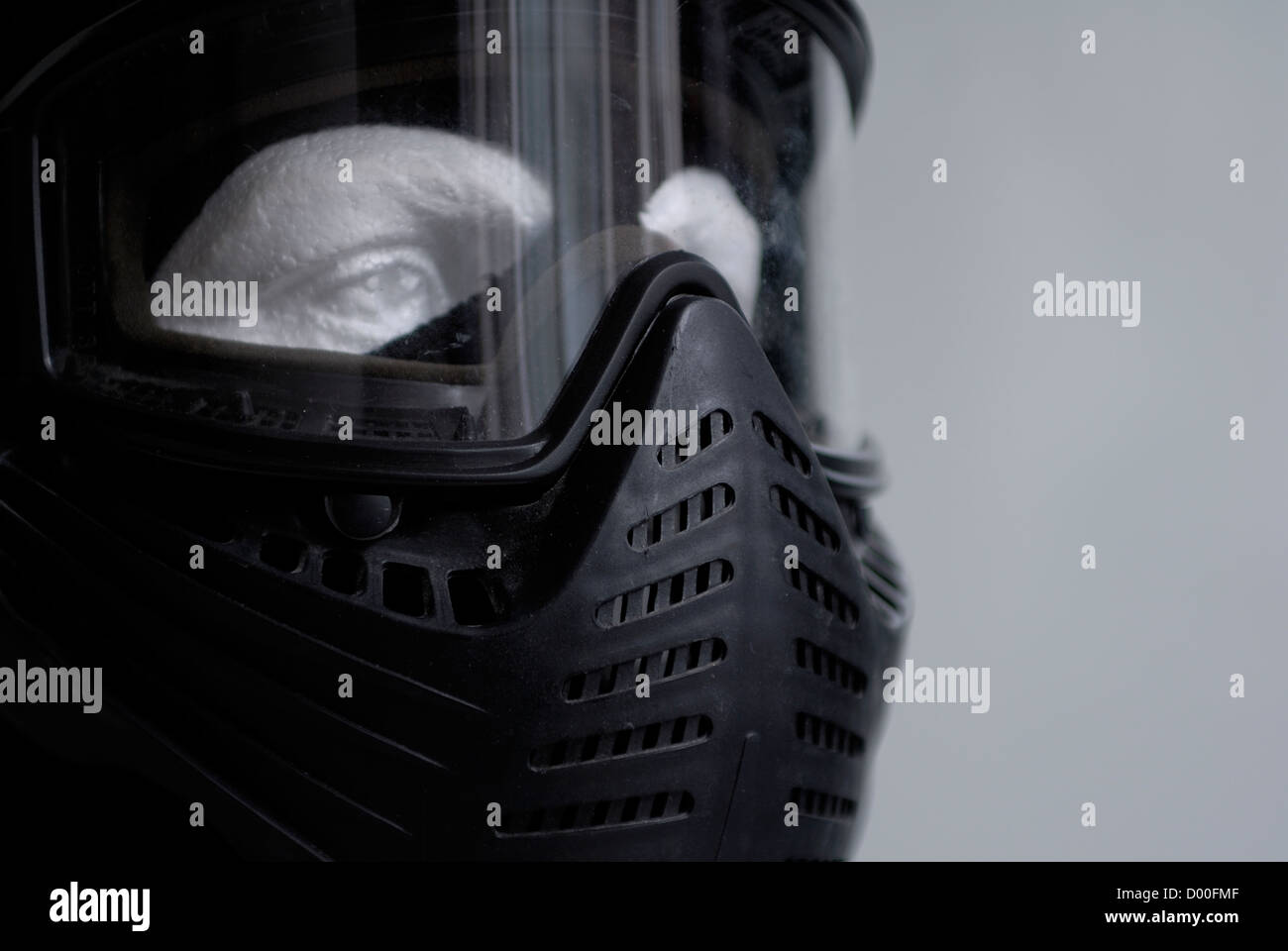 Black paint ball masks on mannequin head Stock Photo - Alamy