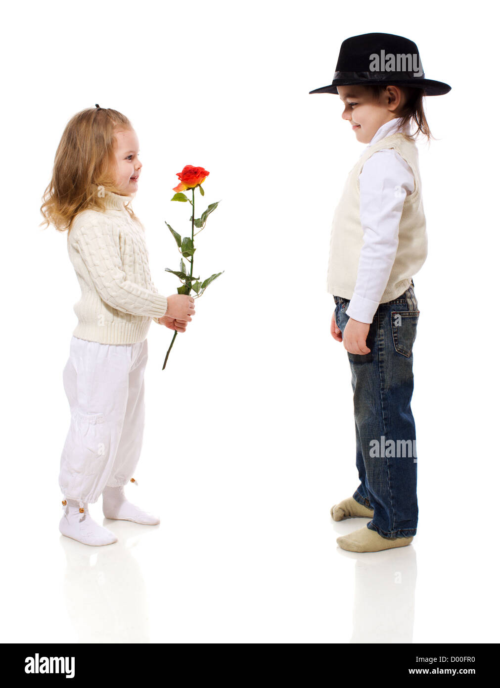 boy giving rose for his little girlfriend isolated on white Stock Photo ...