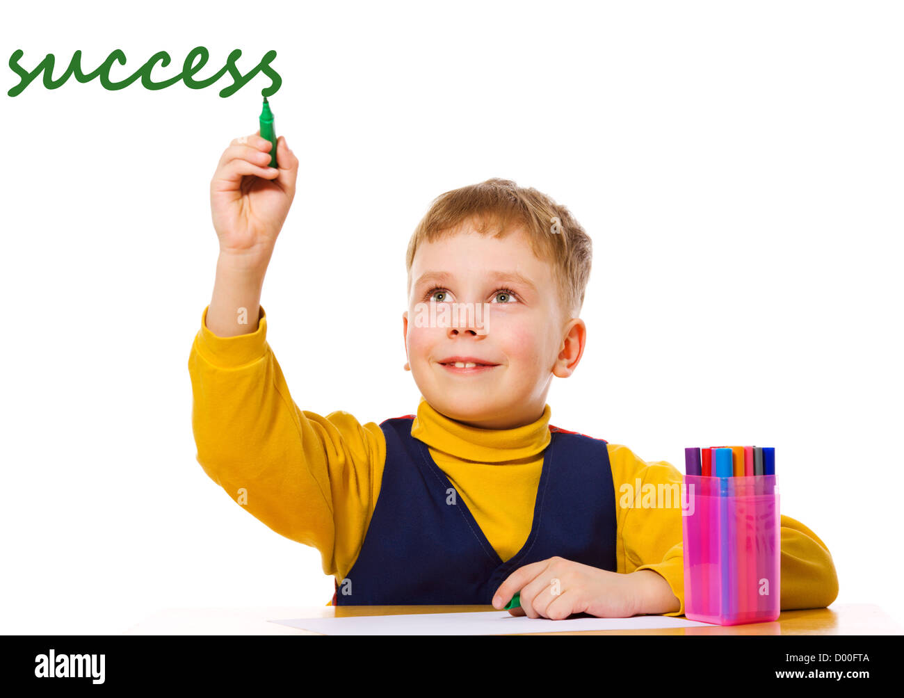 Boy writing success at table isolated on white Stock Photo - Alamy