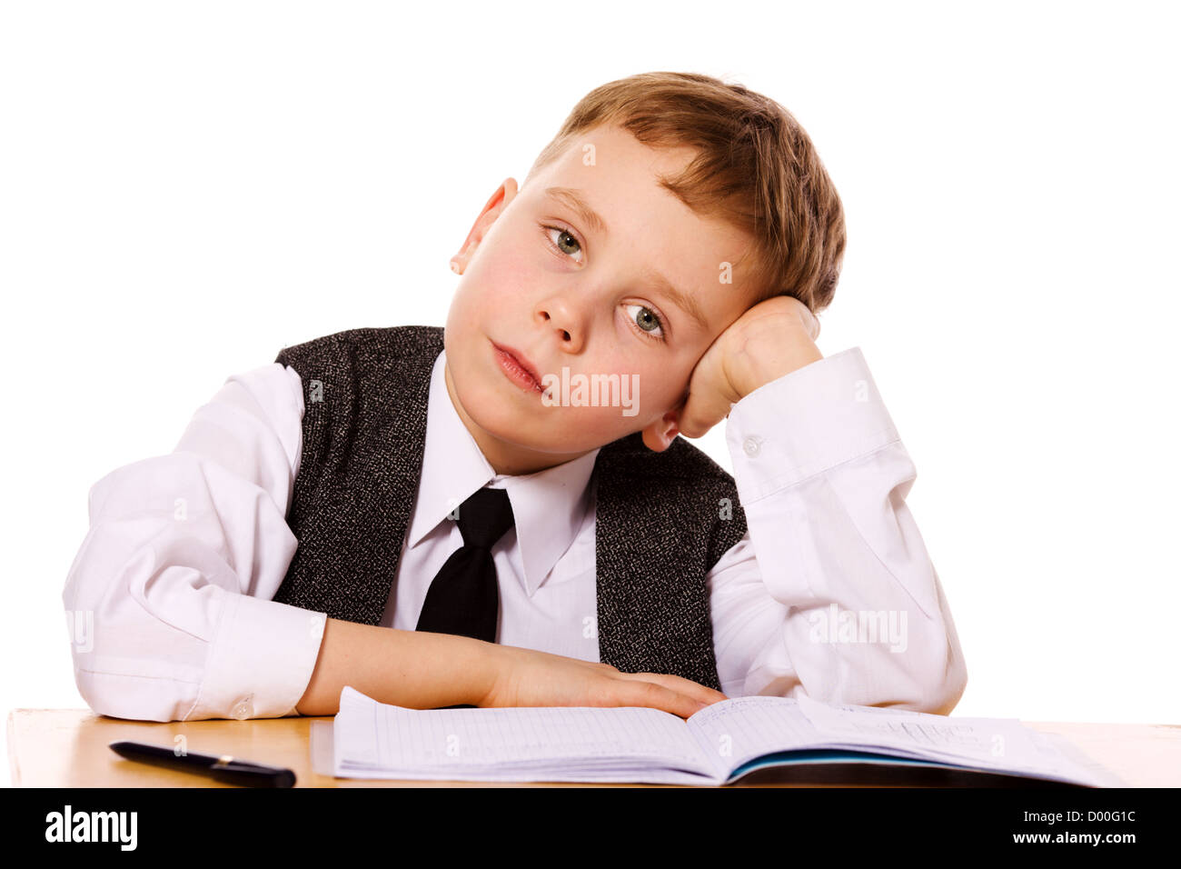 Upset schoolboy doing homework isolated on white Stock Photo - Alamy
