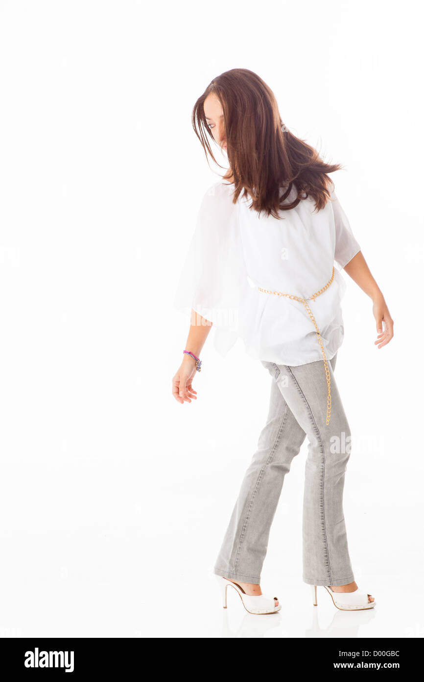 real young beautiful woman walking and looking backside Stock Photo - Alamy