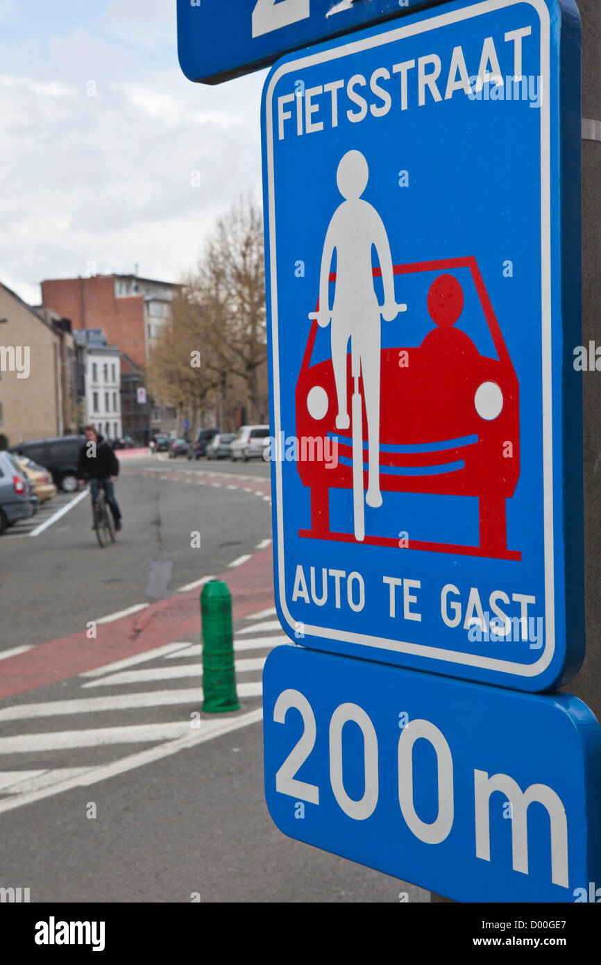 Road signs directed at cyclists and drivers indicate red routes where ...