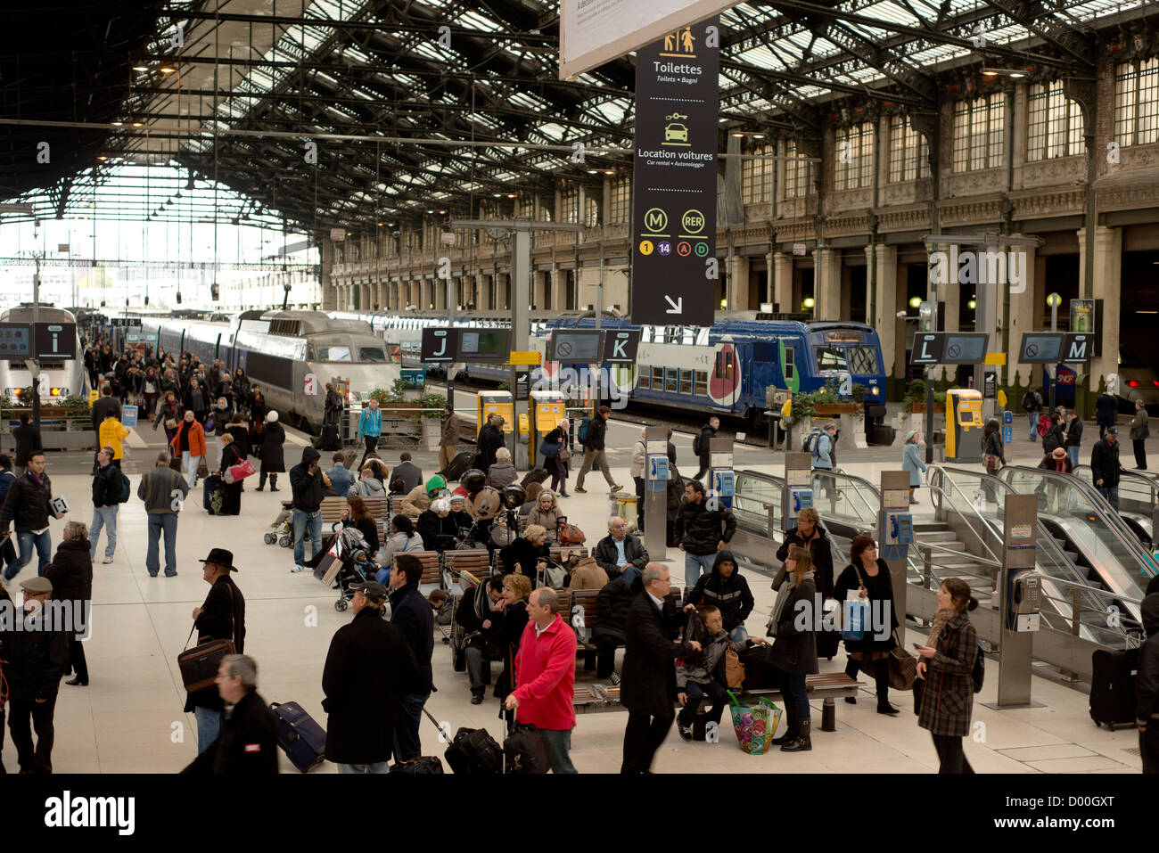 Busy railway station crowded with travelers Stock Photo - Alamy