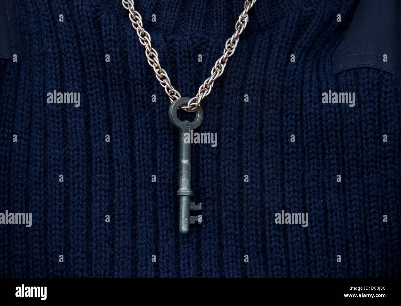 A child wears a key around the neck Stock Photo - Alamy