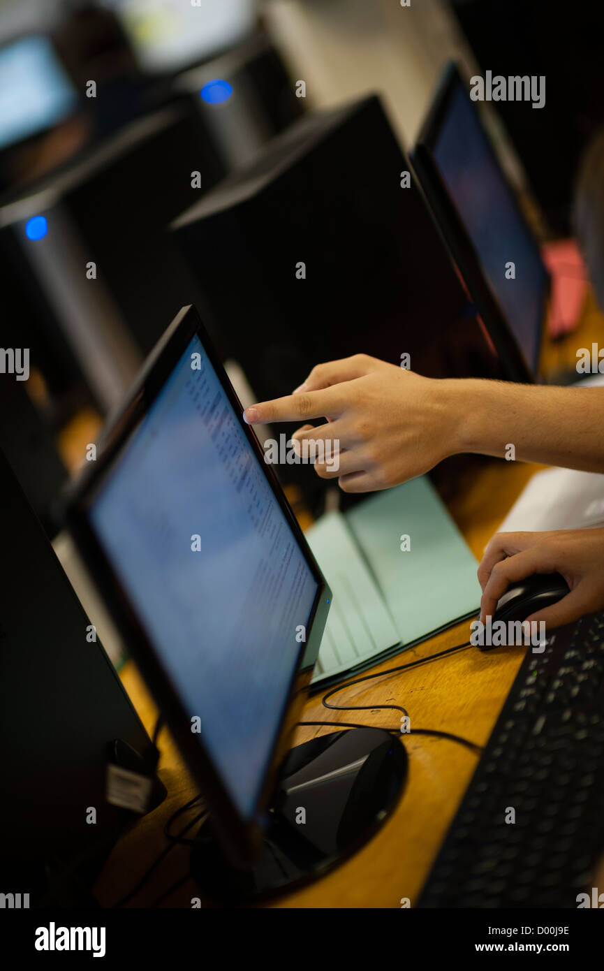 A child using a computer information technology at a secondary ...
