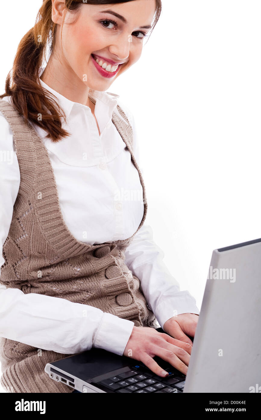 Cute girl typing on laptop on a white isolated background Stock Photo ...