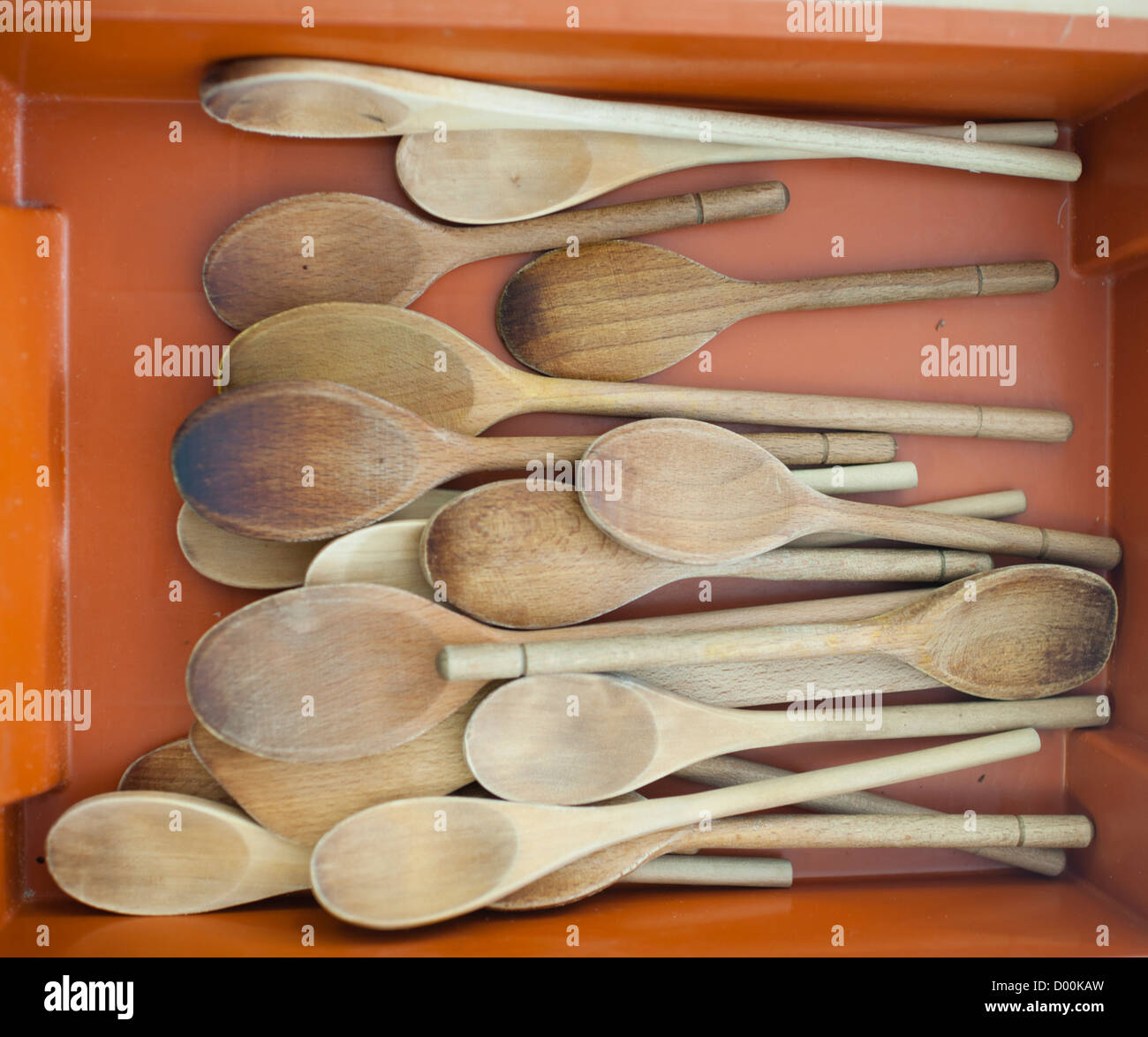 A tray of wooden spoons in a cookery domestic science food technology ...