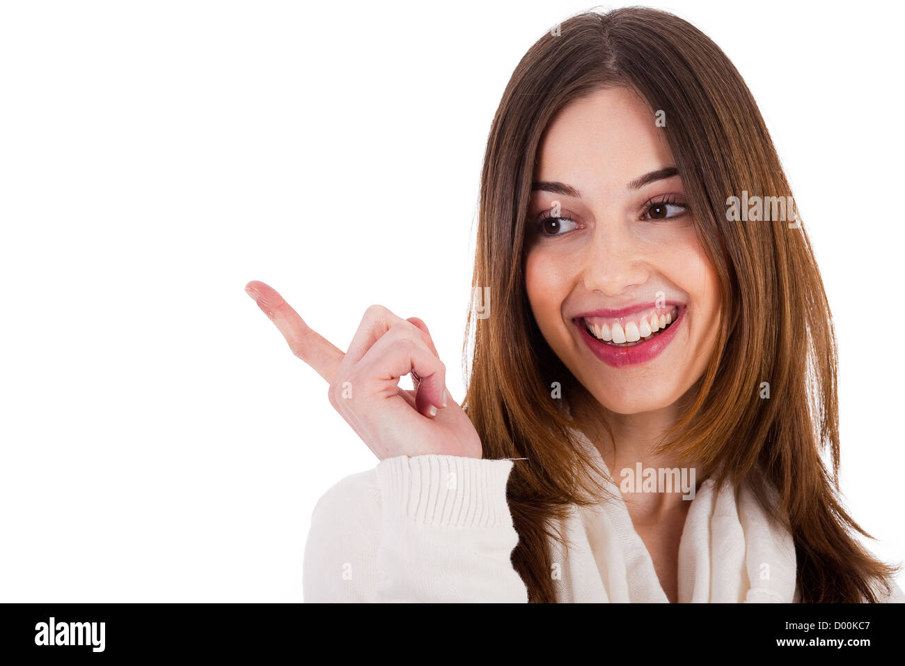 Attractive Female Model Smiling And Pointing Her Finger At Copy Space