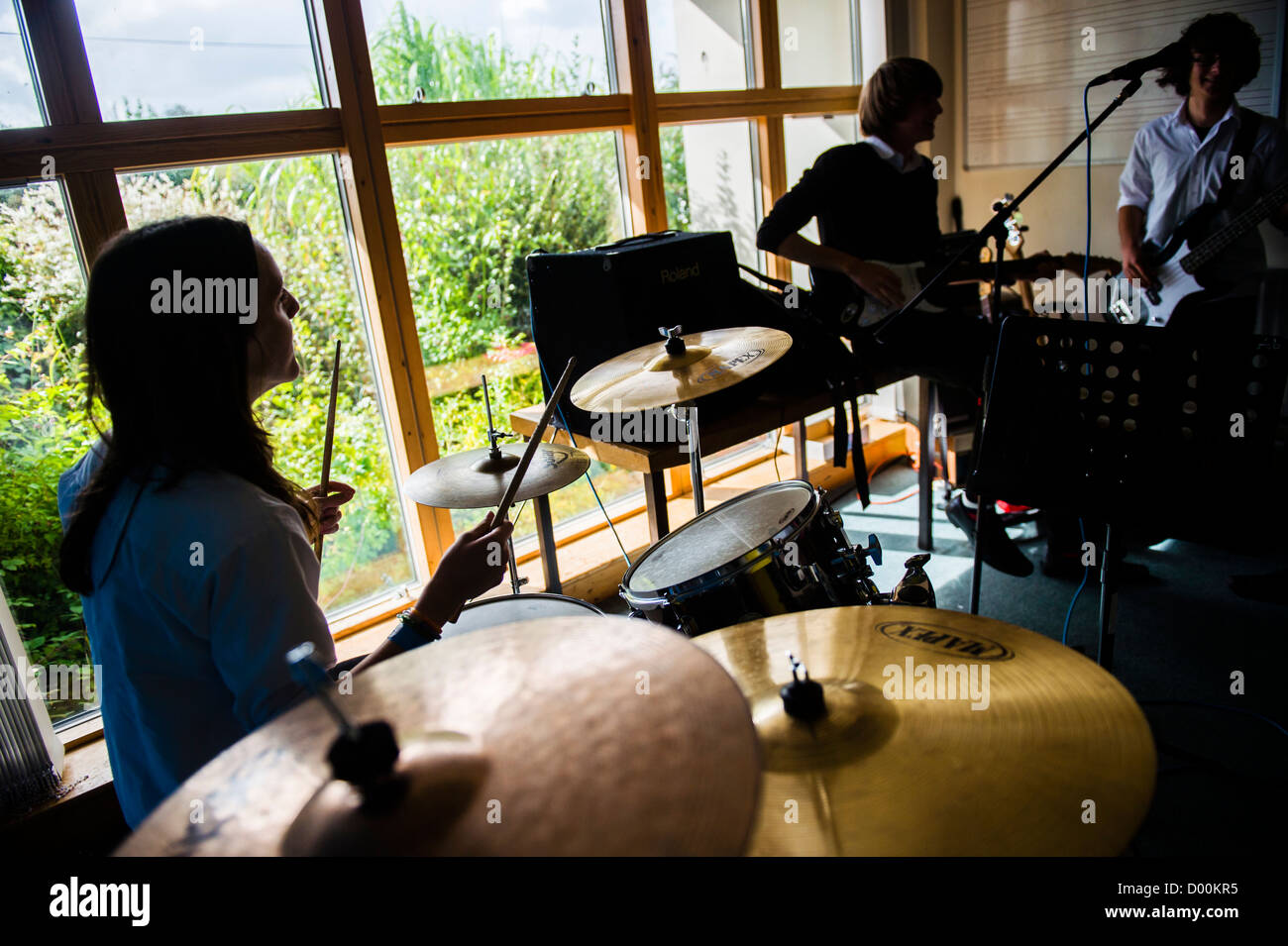 Yea 12 13 Teenage boys playing in a rock band in a sixth form music ...