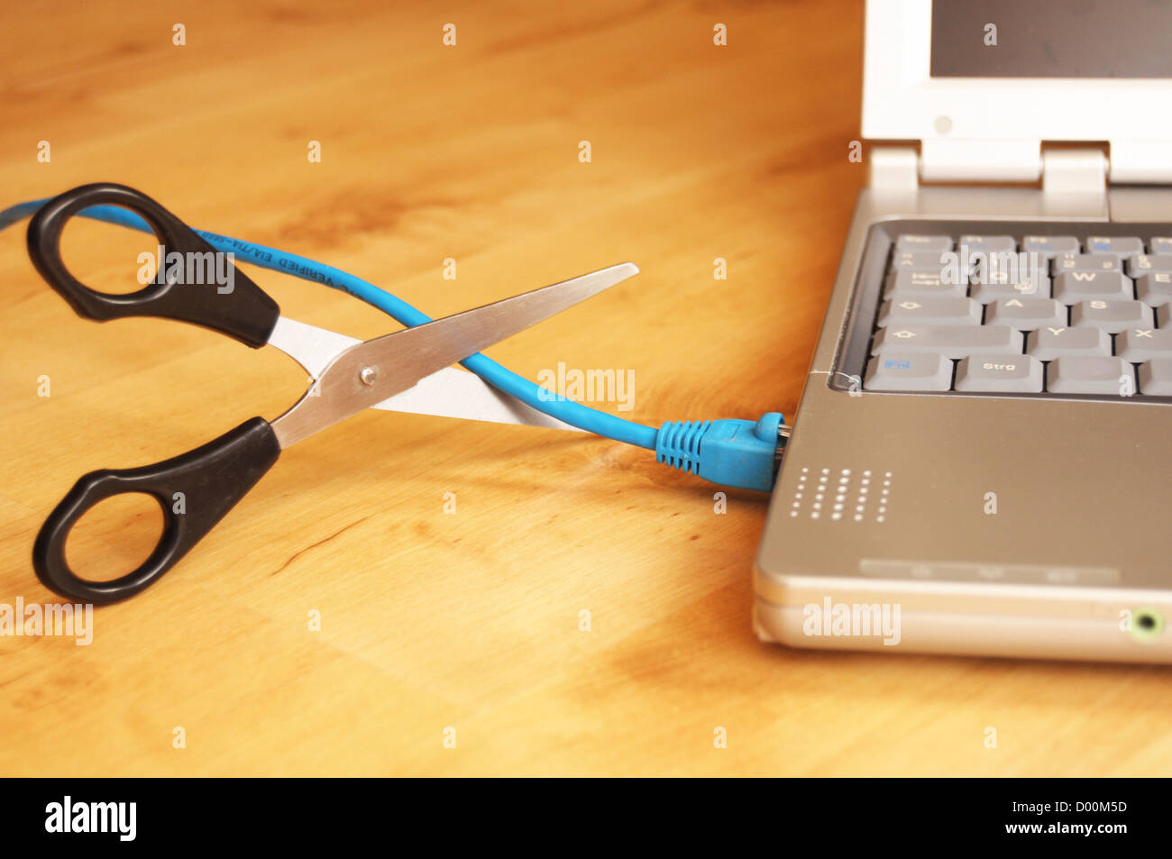 wireless network or wlan concept with laptopn scissors and cable Stock ...