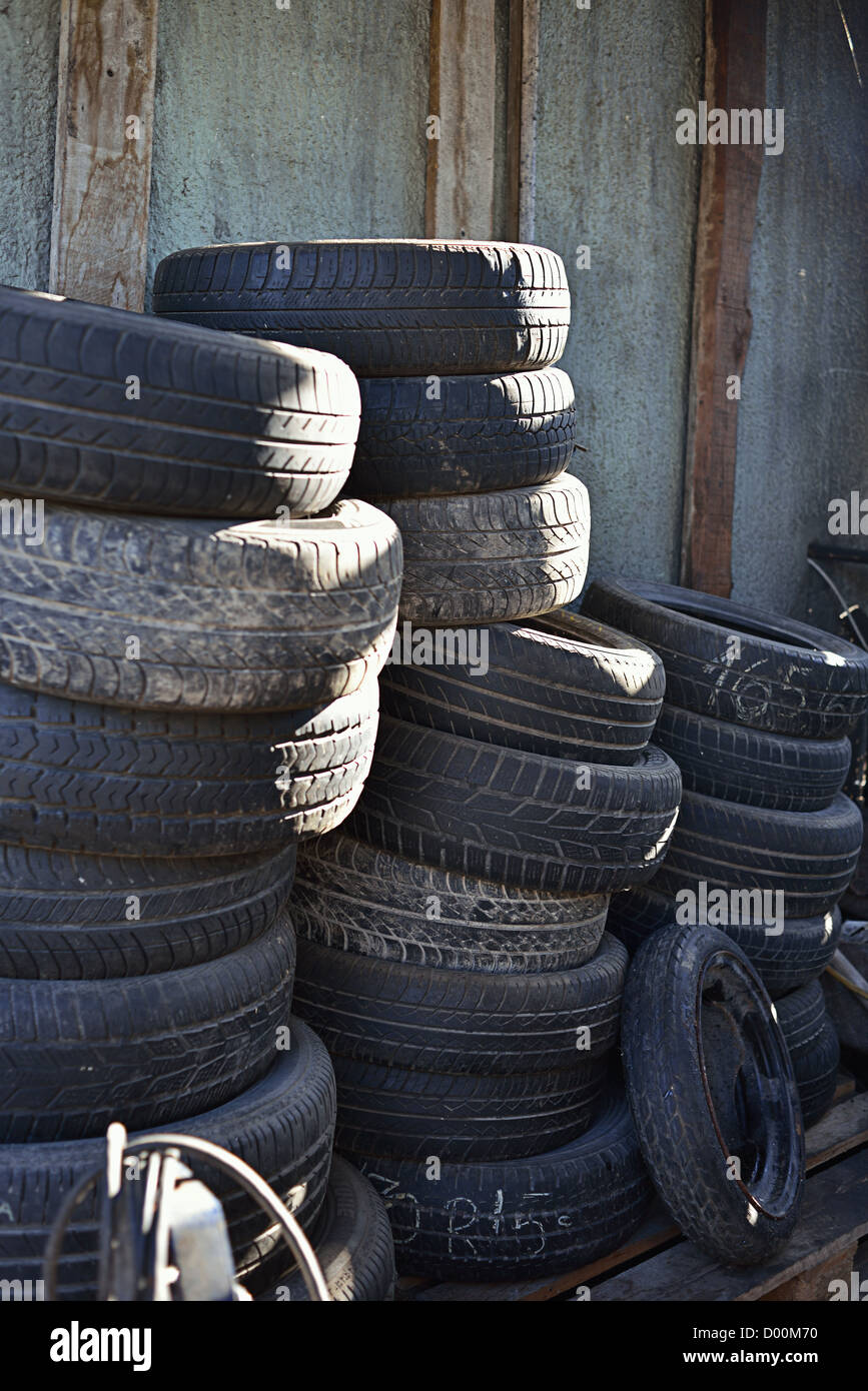 Stack of four wheel old black tires for winter Stock Photo - Alamy