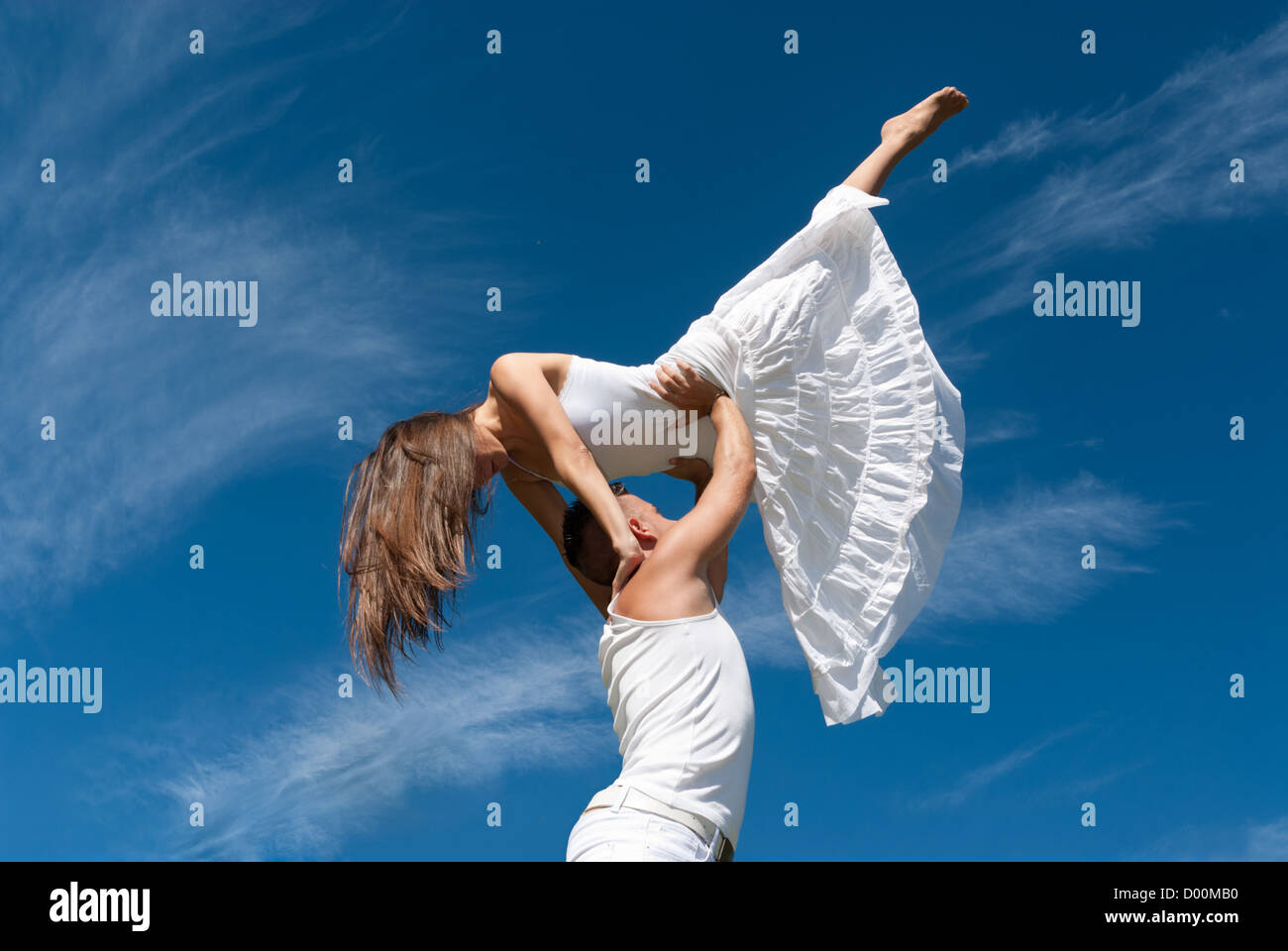 young couple dancing on sky background, freedom and relax symbol Stock ...