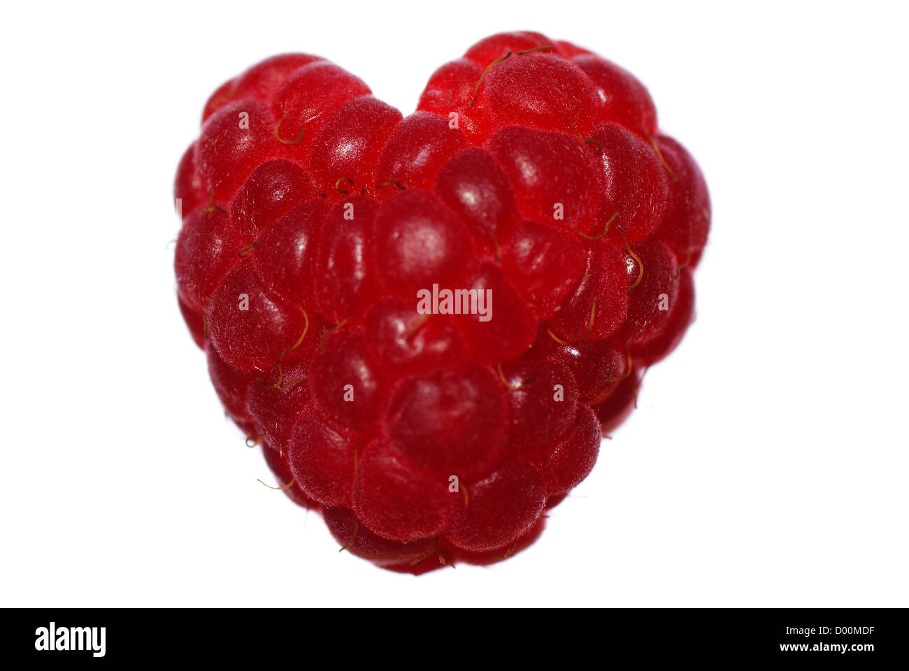 red raspberry in heart form on white background Stock Photo - Alamy