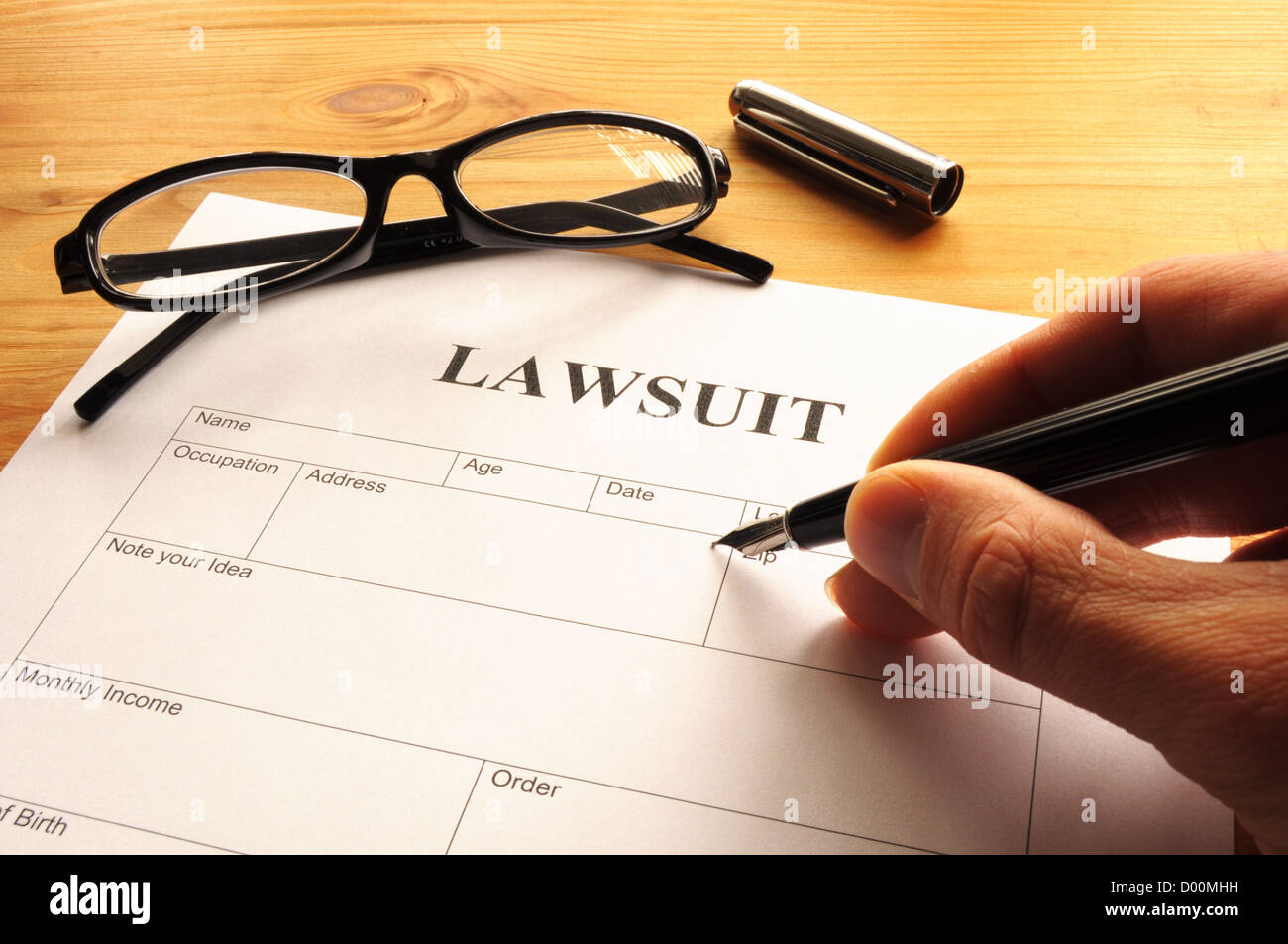 lawsuit form or document in business office Stock Photo - Alamy