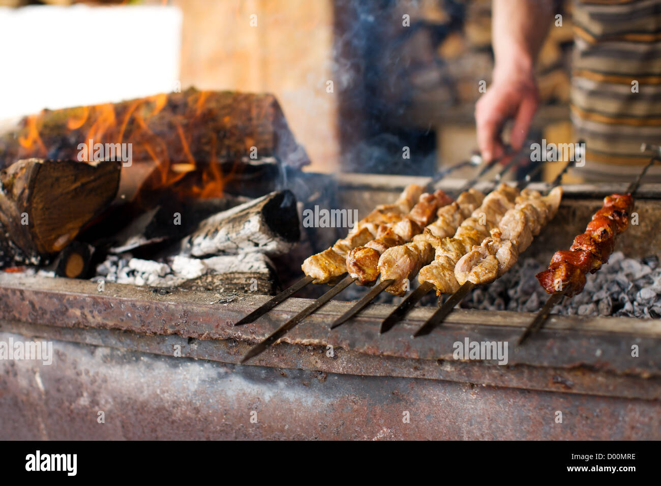 shish kebab in process of cooking on open fire outdoors Stock Photo - Alamy