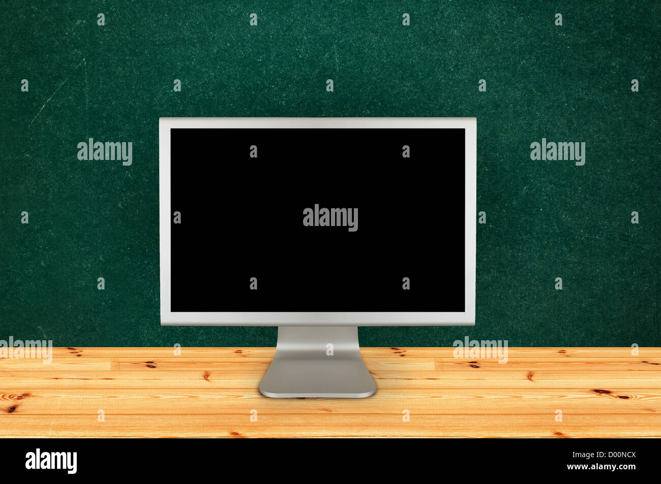 Classroom computer monitor in front of the green chalkboard Stock Photo ...