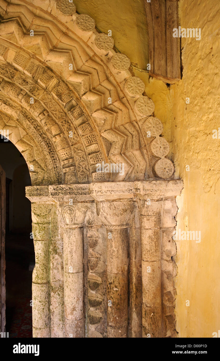 Detail of arch and pillars in the Norman doorway of the church of St ...