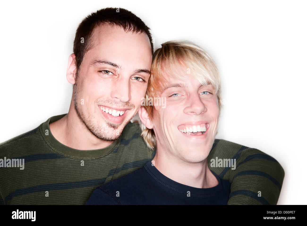 Two handsome men posing for portrait on white background Stock Photo ...