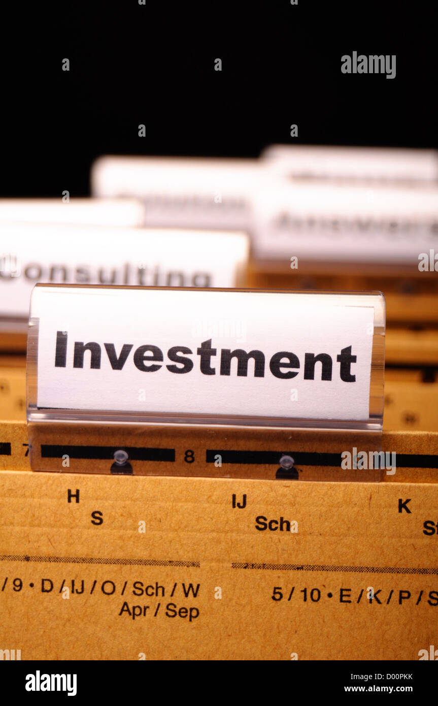 investment word on business folder showing financial success concept ...