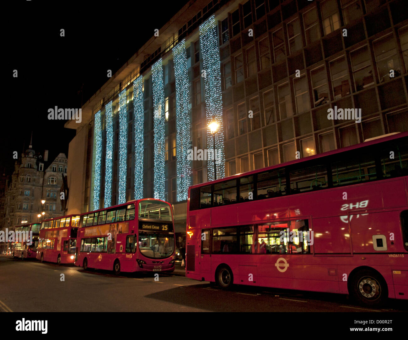 Double decker buses at night near John Lewis, Oxford Street, West End ...