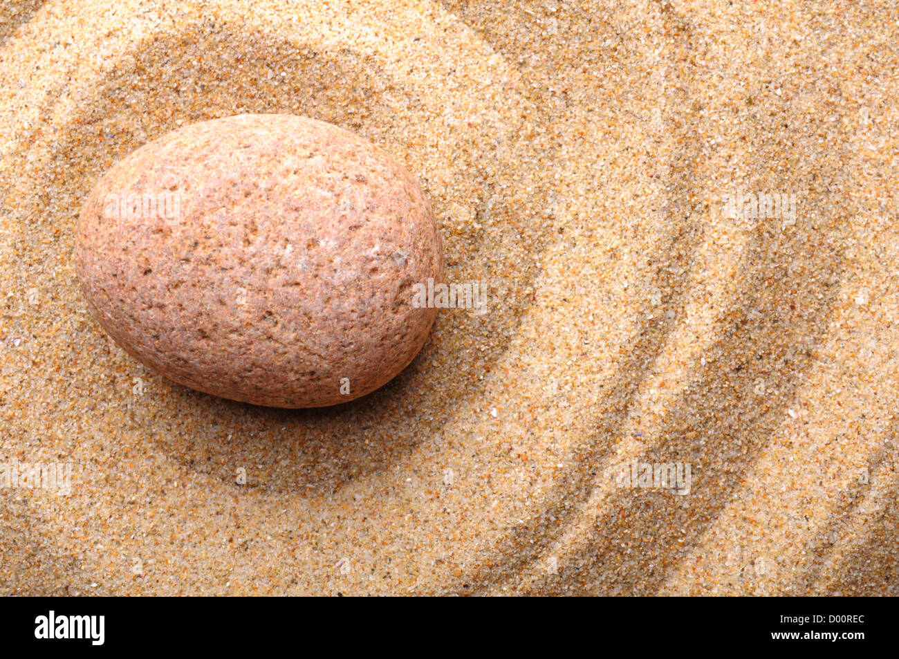 zen stone with leaf on sand showing spa concept Stock Photo - Alamy