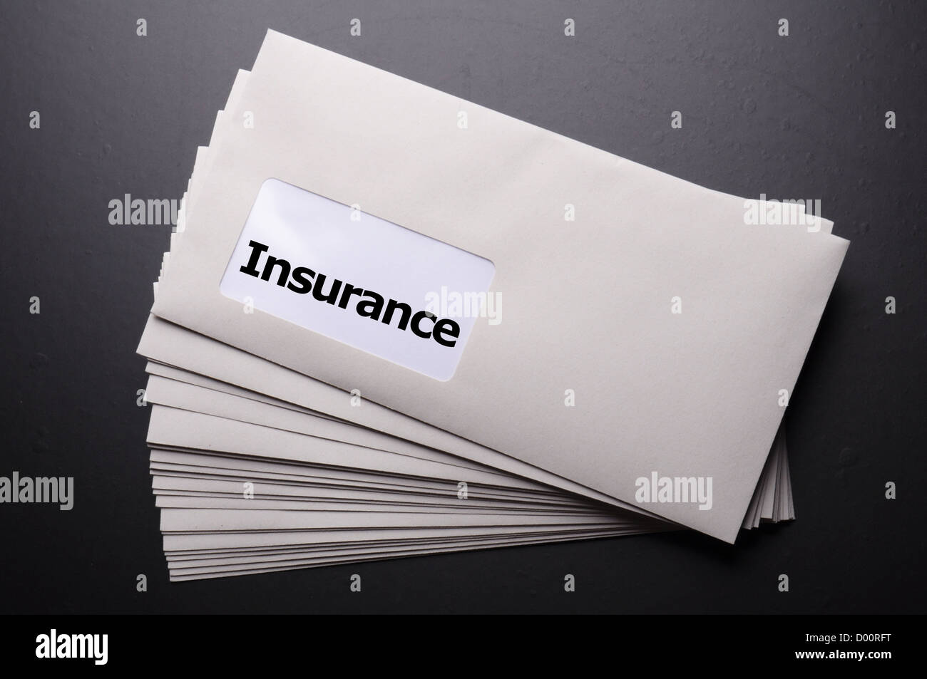 insurance concept with envelope showing risk concept Stock Photo - Alamy