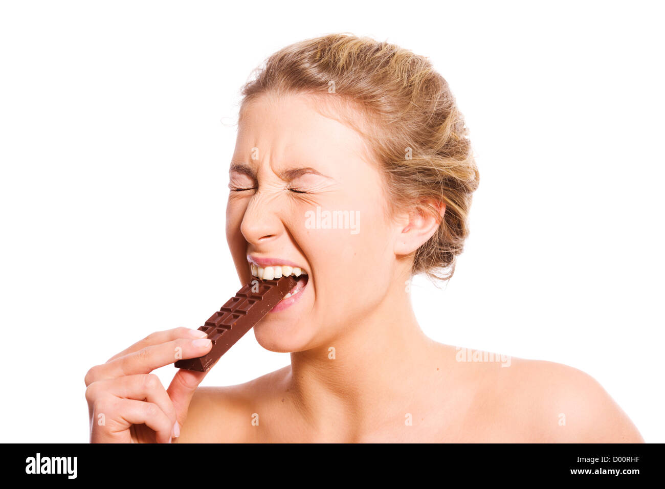 Young woman biting chocolate bar isolated on white Stock Photo - Alamy