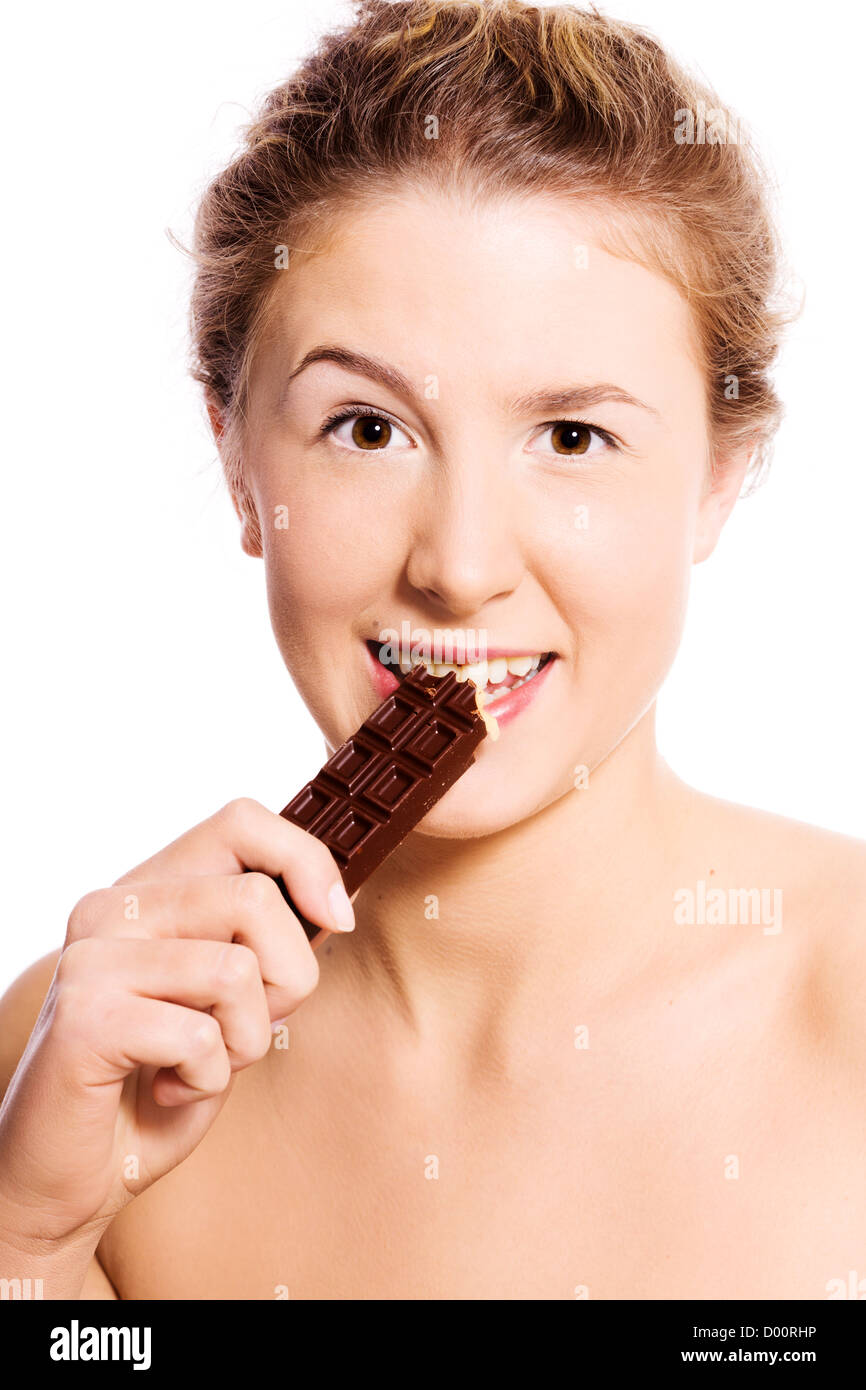Young woman biting chocolate bar isolated on white Stock Photo - Alamy