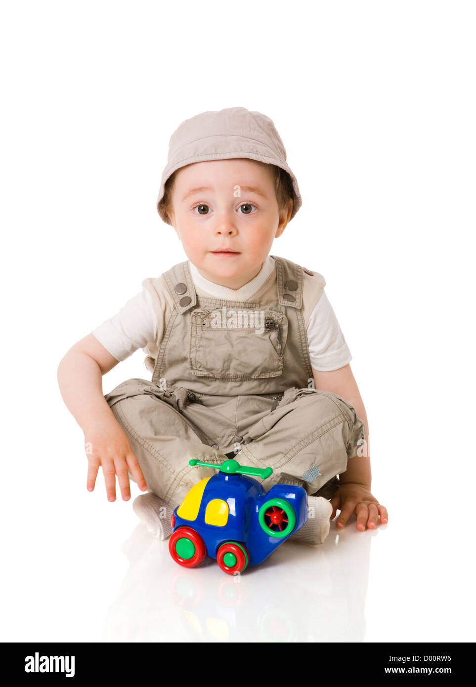 Baby boy playing with colorful car toy isolated on white Stock Photo ...
