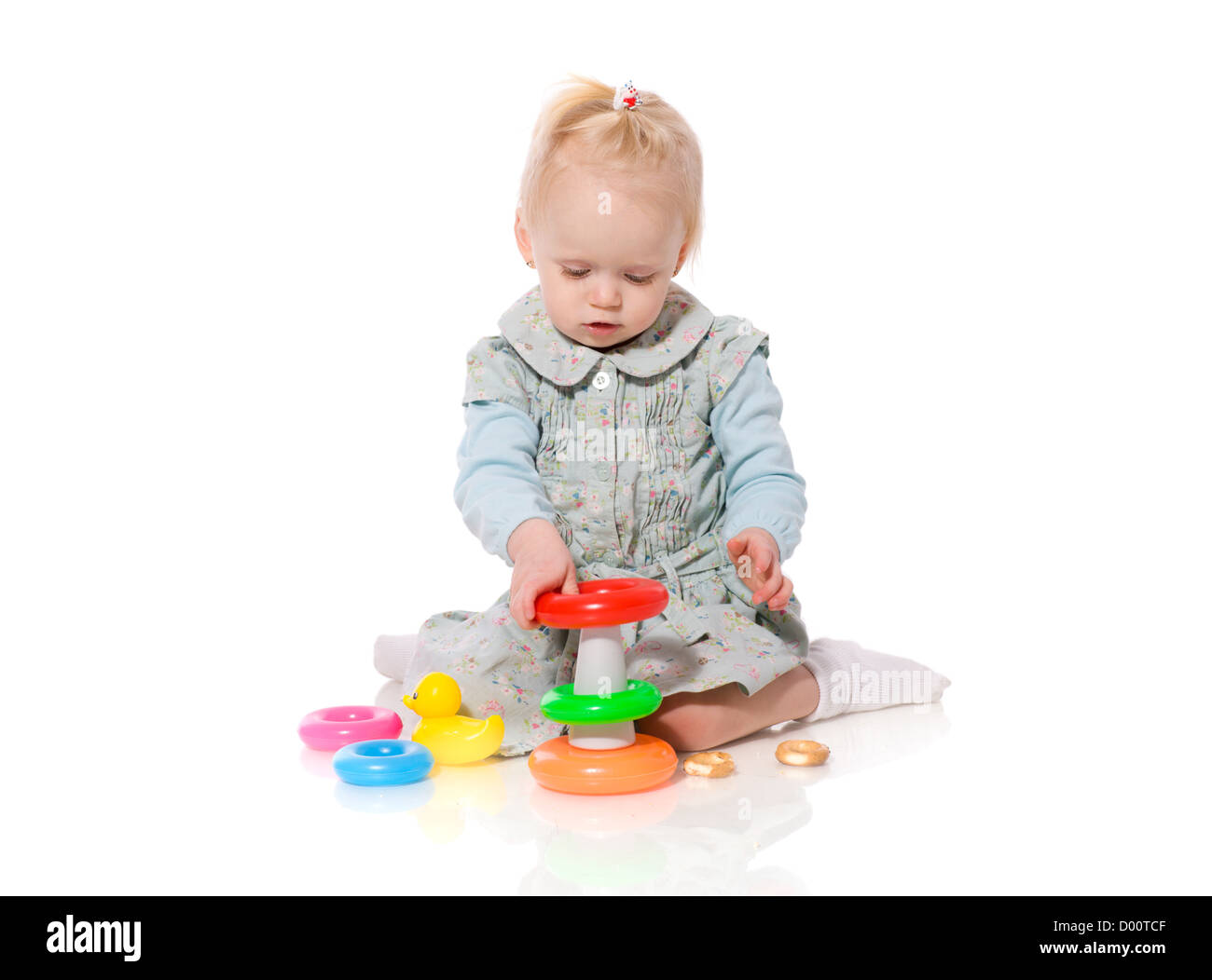 Little girl playing with pyramid isolated on white Stock Photo - Alamy